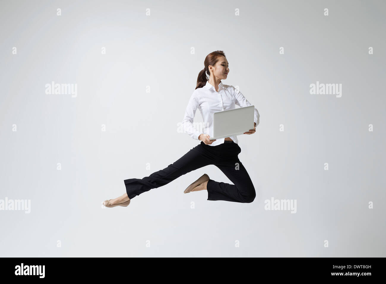 Woman making dance poses laptop hi-res stock photography and images - Alamy