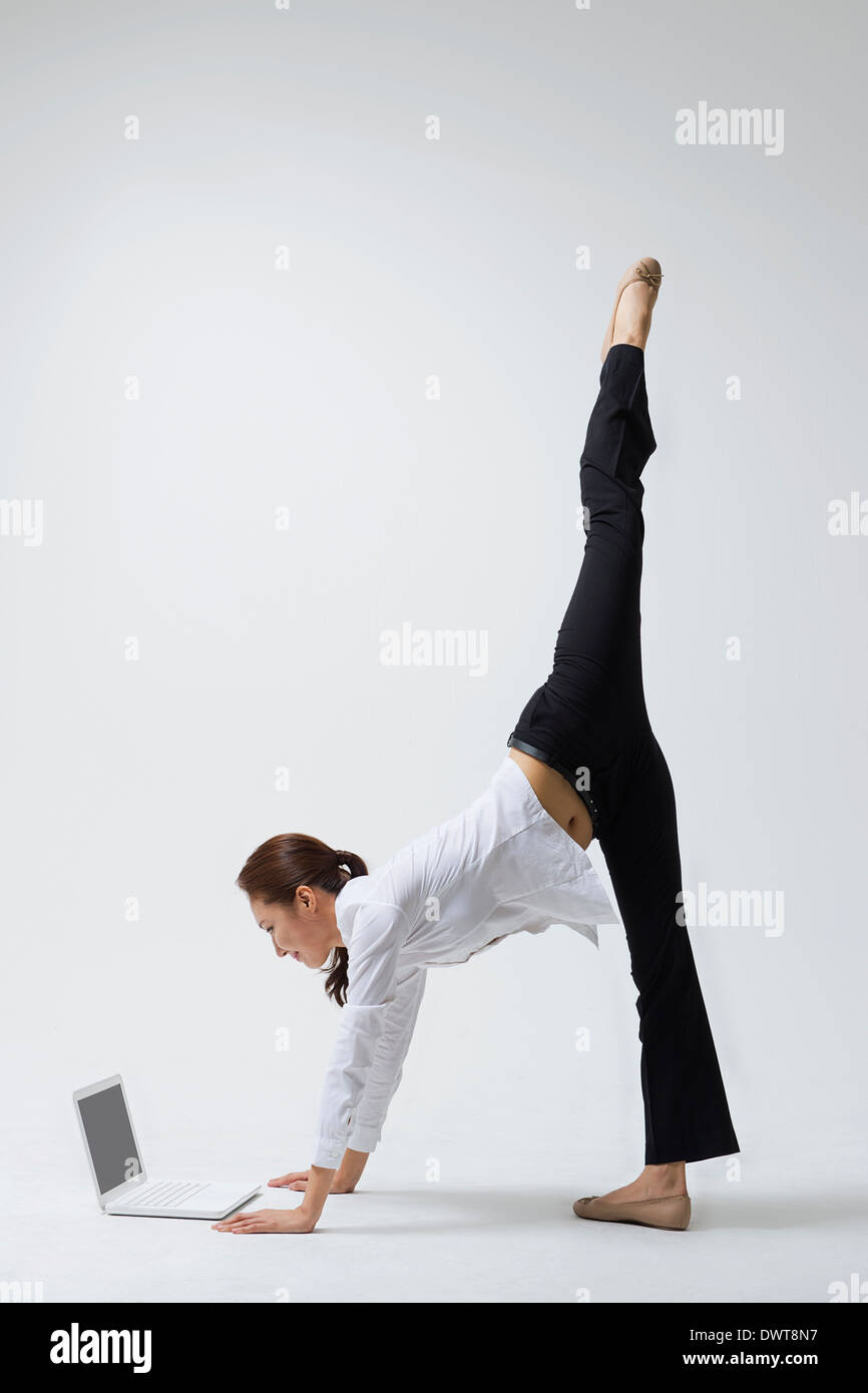 Woman making dance poses laptop hi-res stock photography and images - Alamy