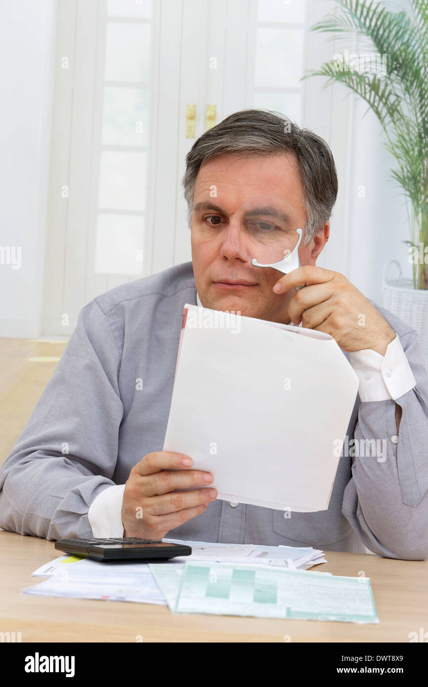 Man paperwork calculator hi-res stock photography and images - Alamy