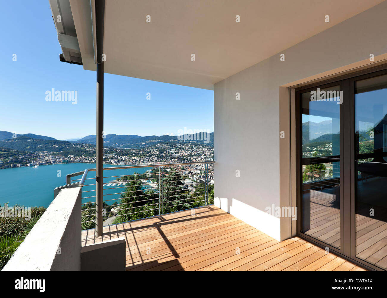 Modern apartment, balcony overlooking the lake Stock Photo - Alamy
