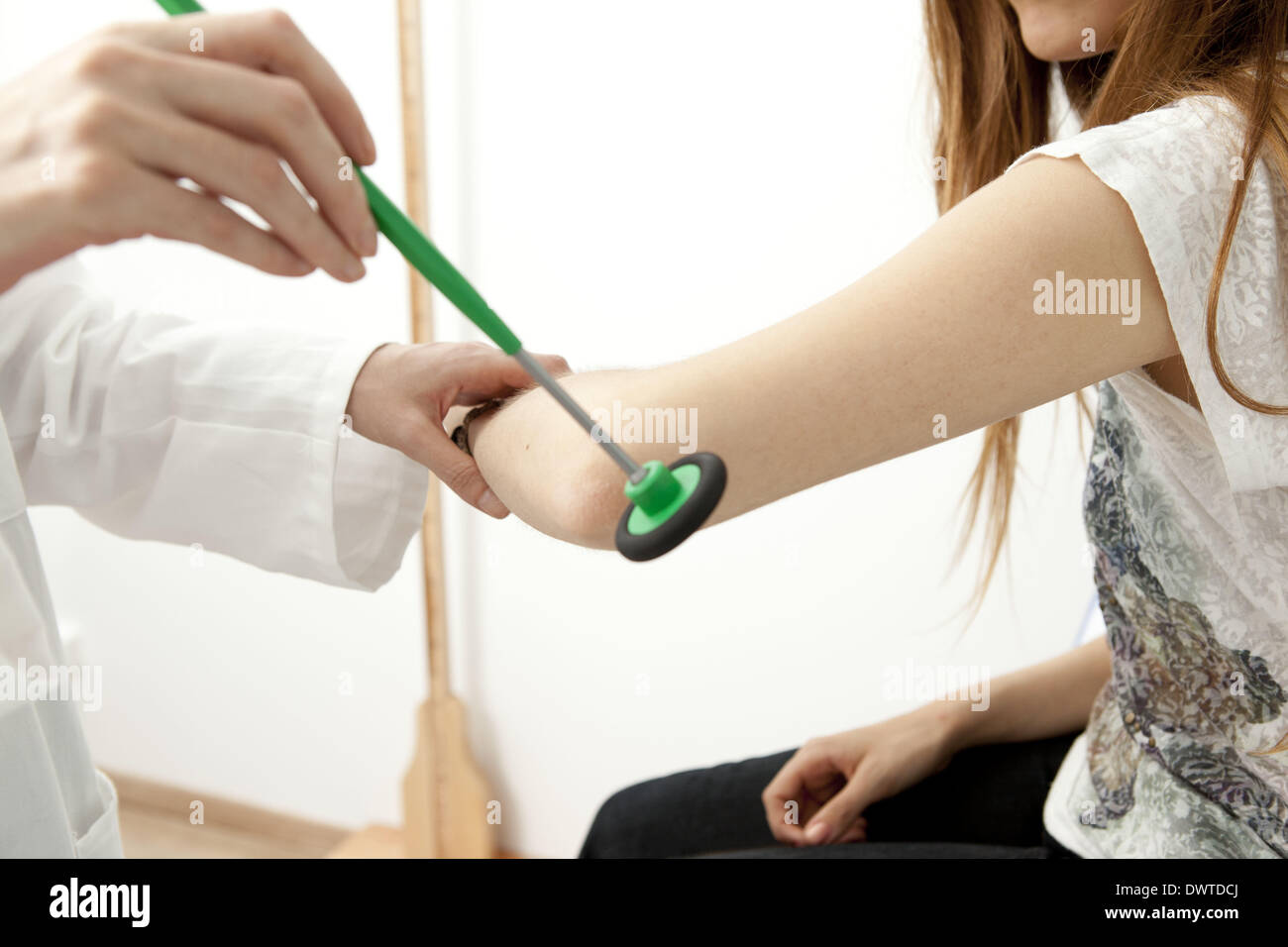 Reflex hammer woman Stock Photo - Alamy