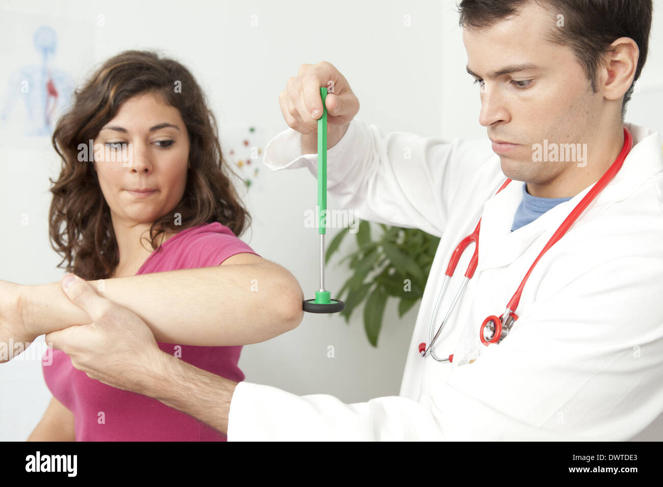 Reflex hammer woman Stock Photo - Alamy