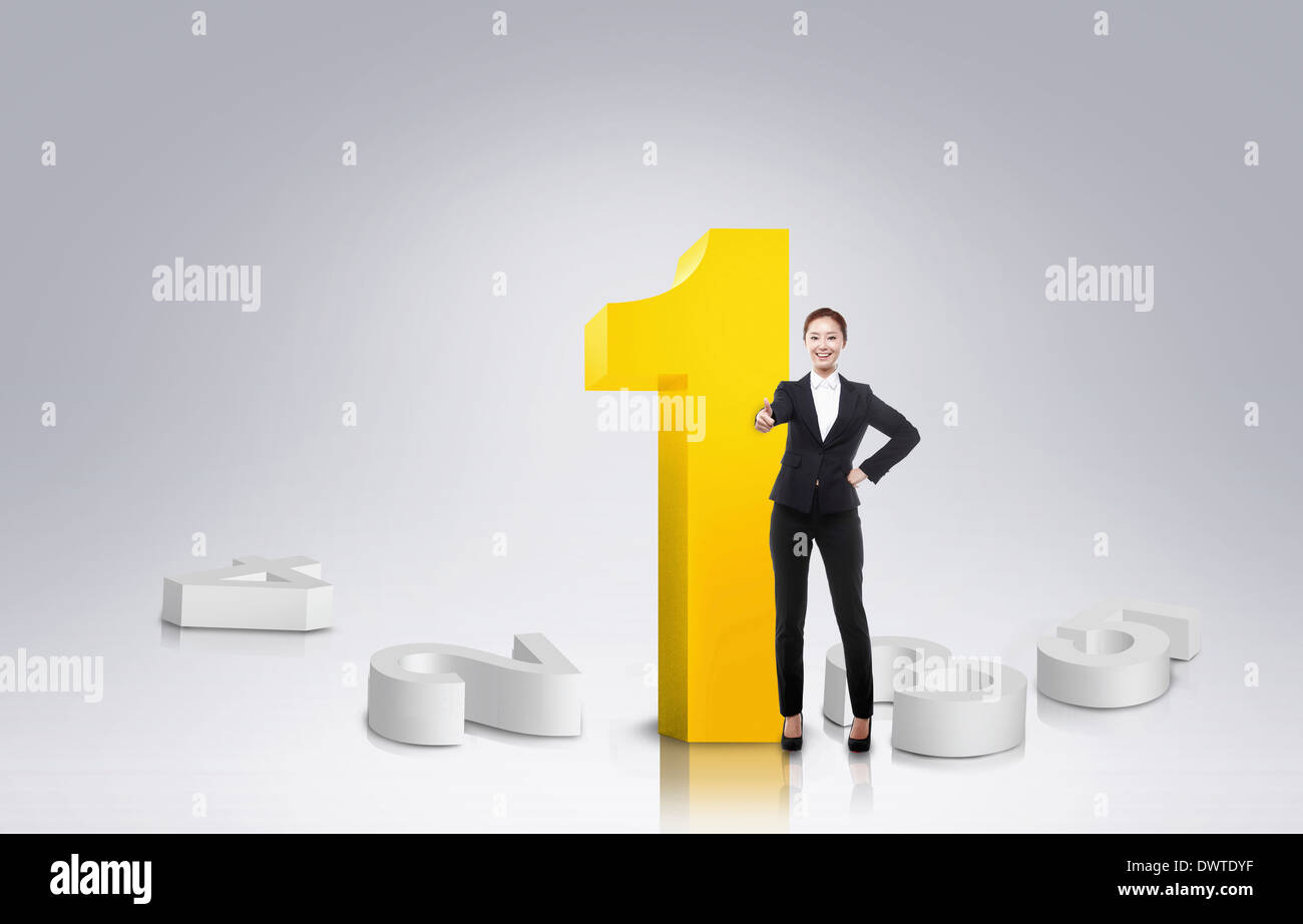 a business woman next to number one Stock Photo - Alamy
