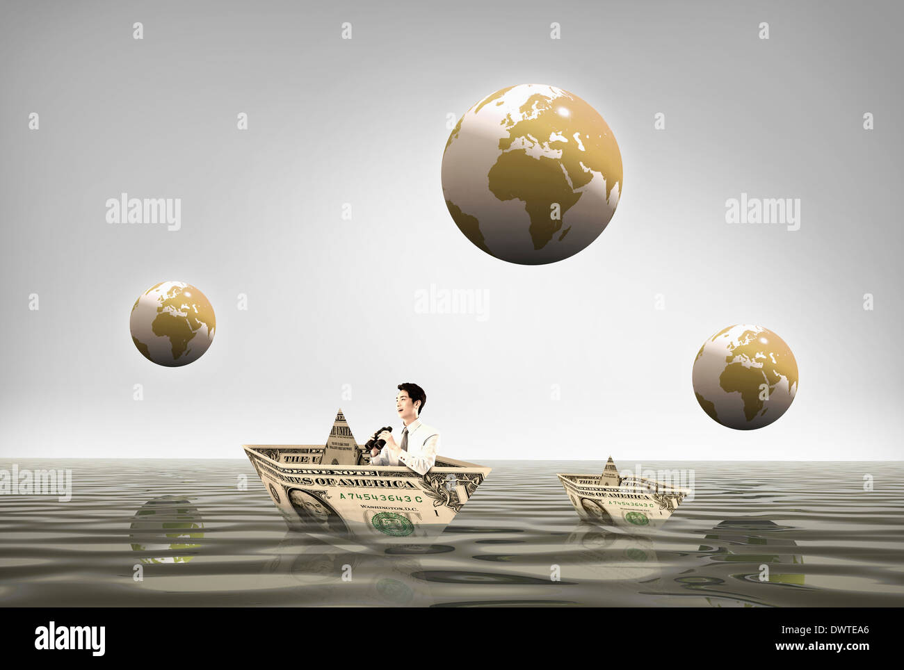 a business man sailing under the globes Stock Photo - Alamy