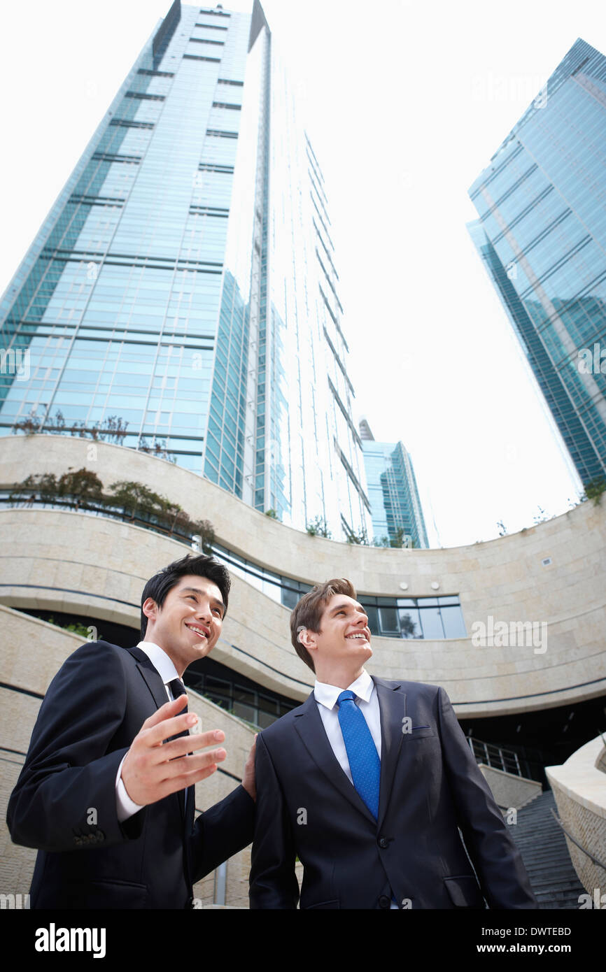 two business men talking outside Stock Photo - Alamy