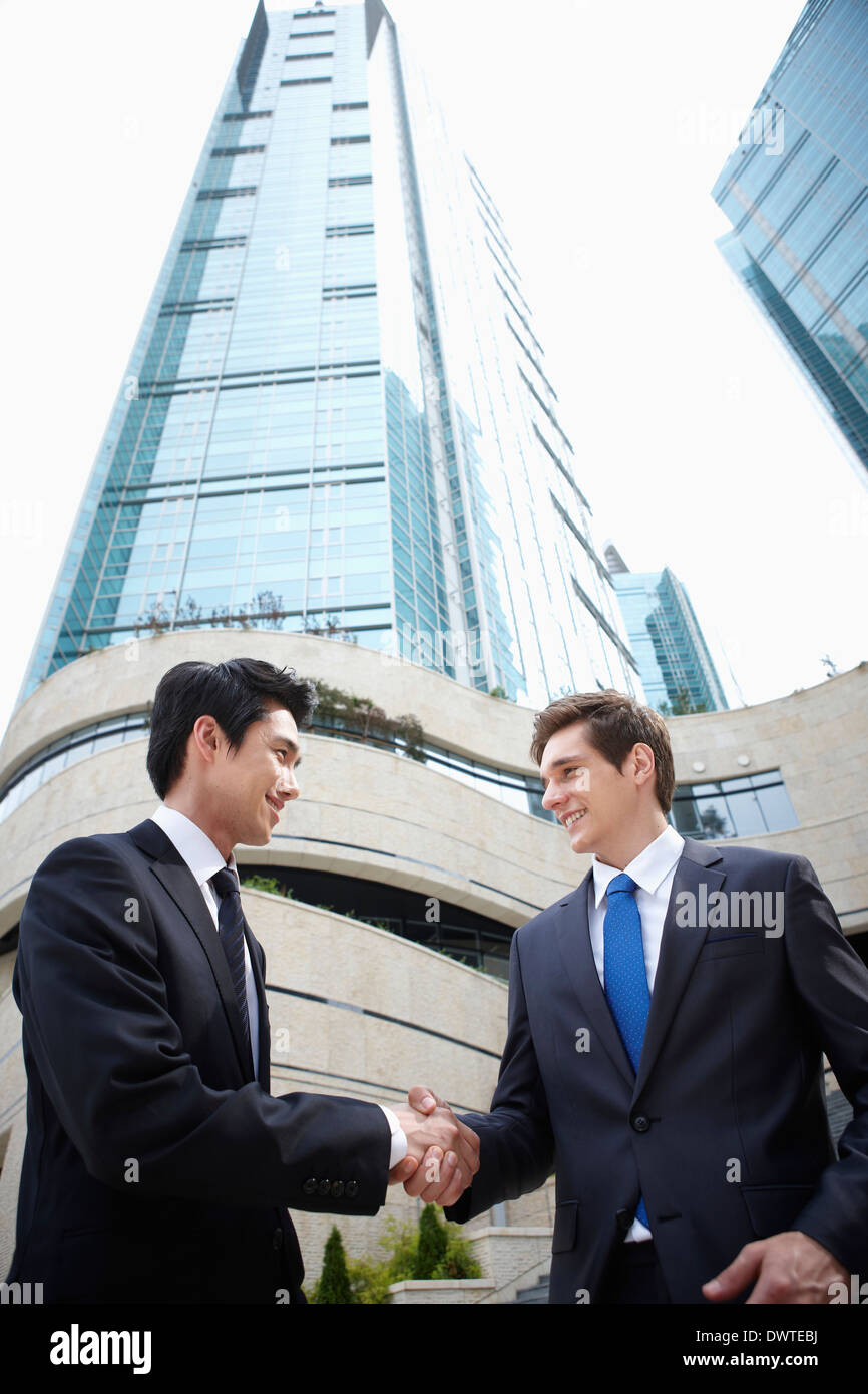 two business men talking outside Stock Photo - Alamy