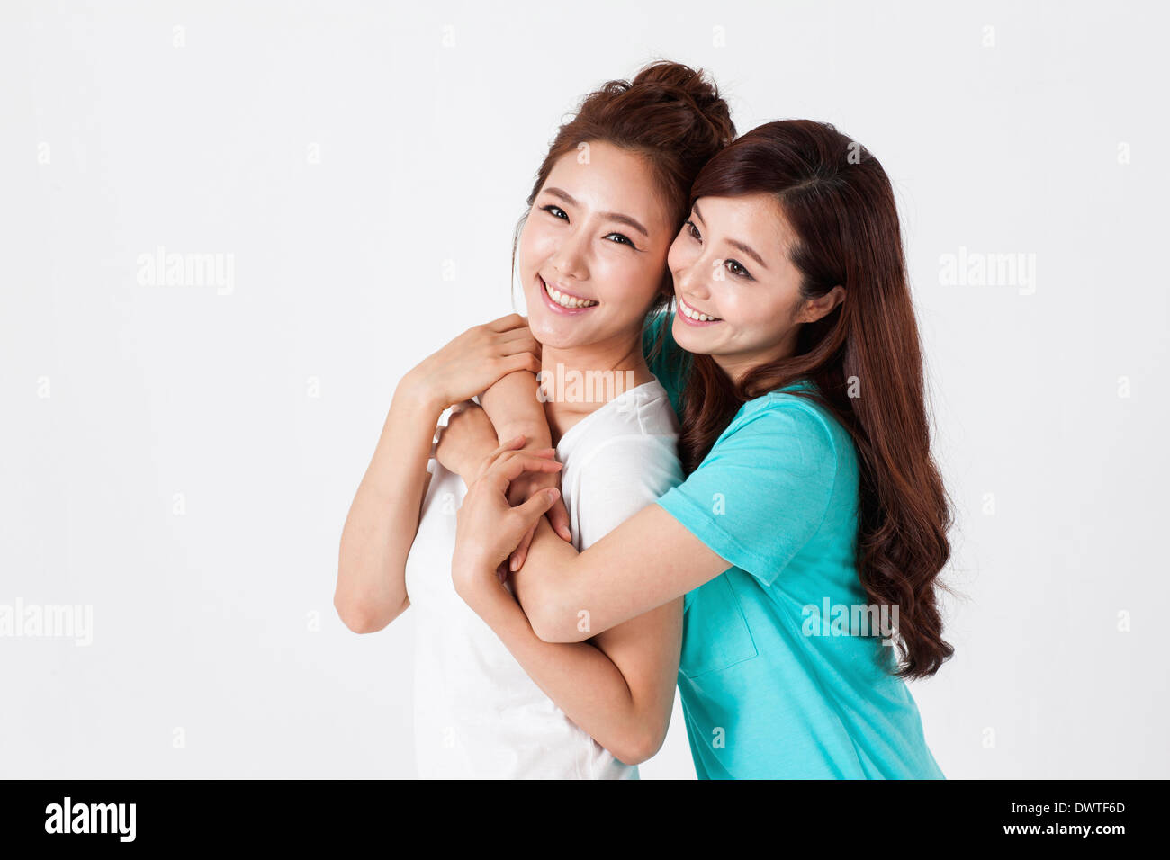 two women hugging and posing Stock Photo - Alamy