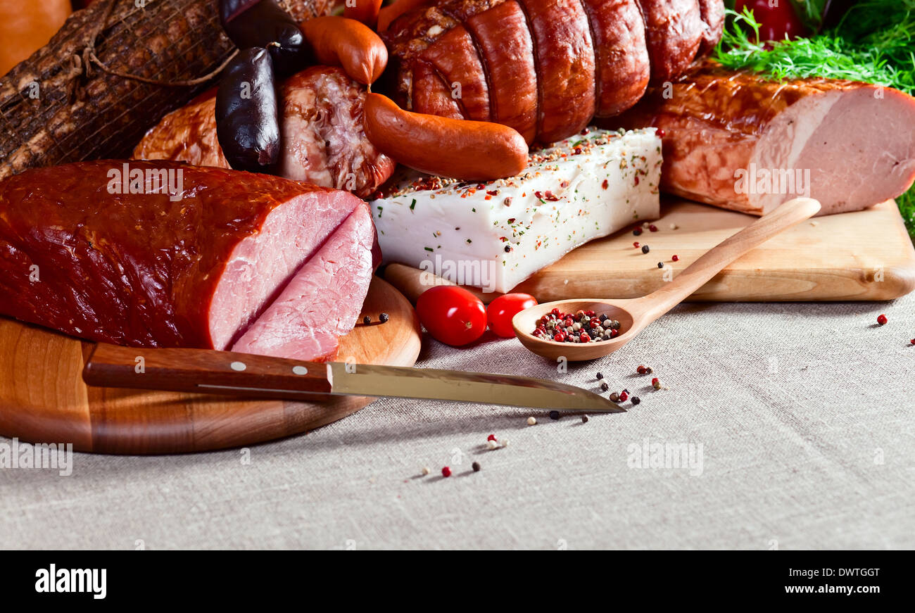 smoked meat and sausages on a linen cloth Stock Photo - Alamy