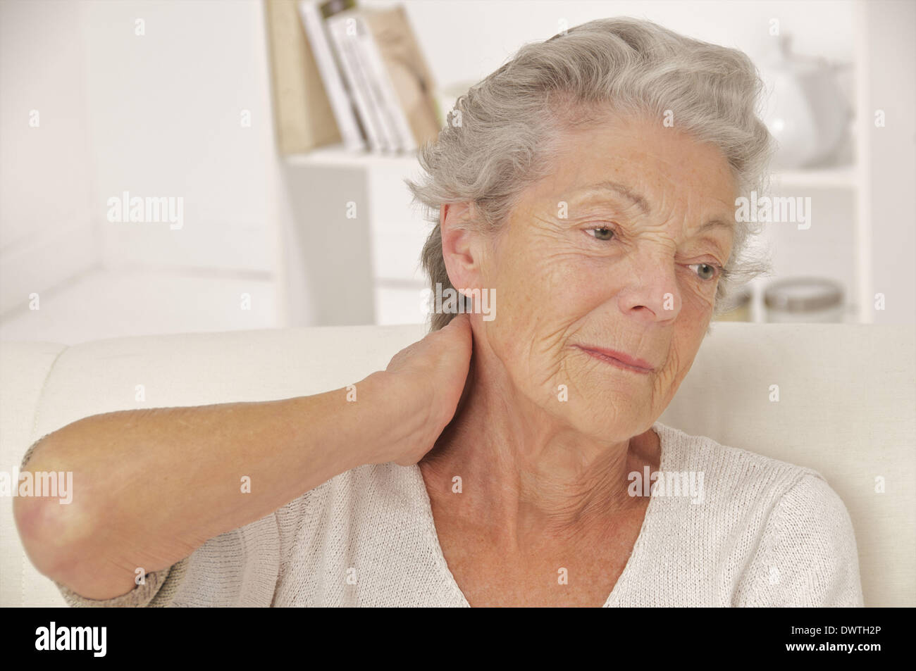 Nape of the neck pain senior Stock Photo - Alamy
