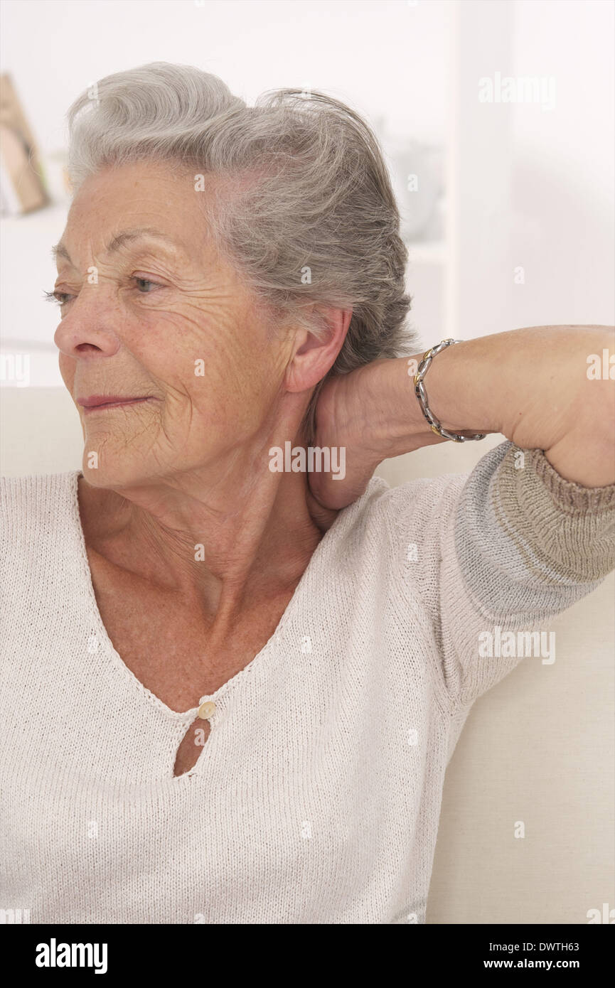 Nape of the neck pain senior Stock Photo - Alamy