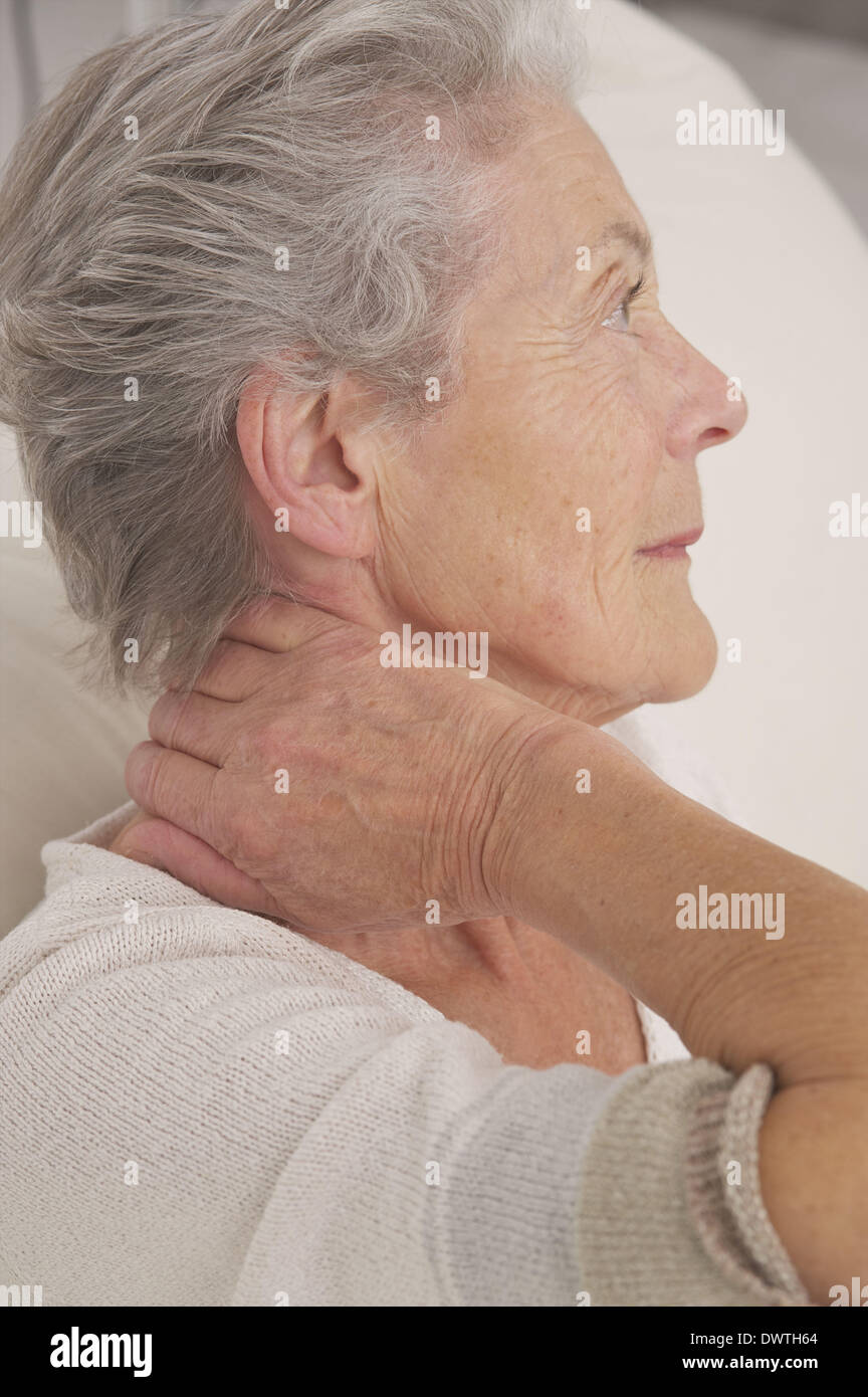 Nape of the neck pain senior Stock Photo - Alamy