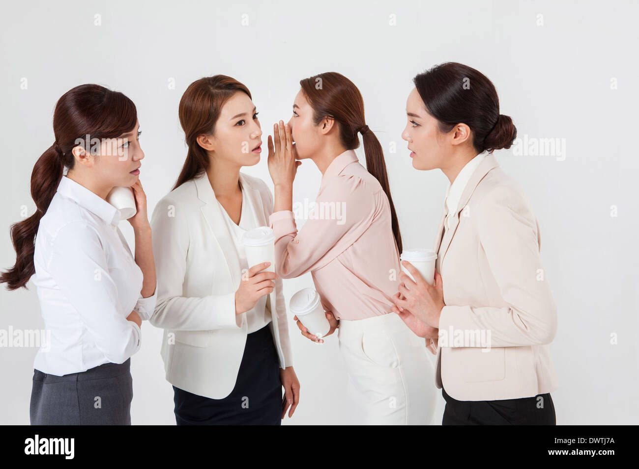 Women gossiping group hi-res stock photography and images - Alamy