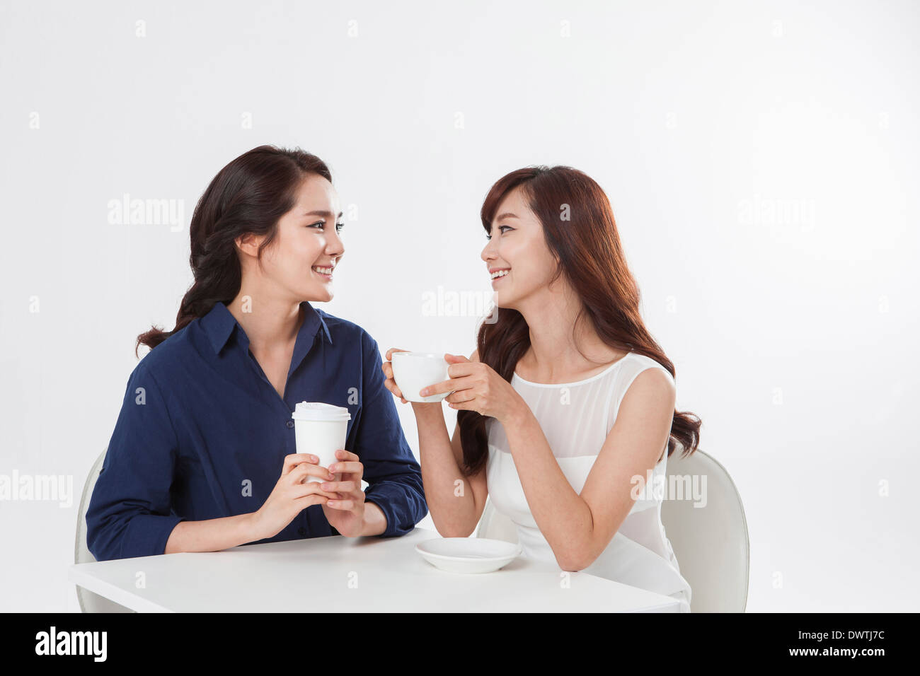 two women having a coffee Stock Photo - Alamy