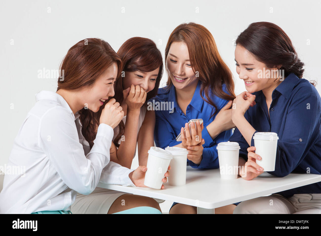 a group of women having a coffee Stock Photo - Alamy