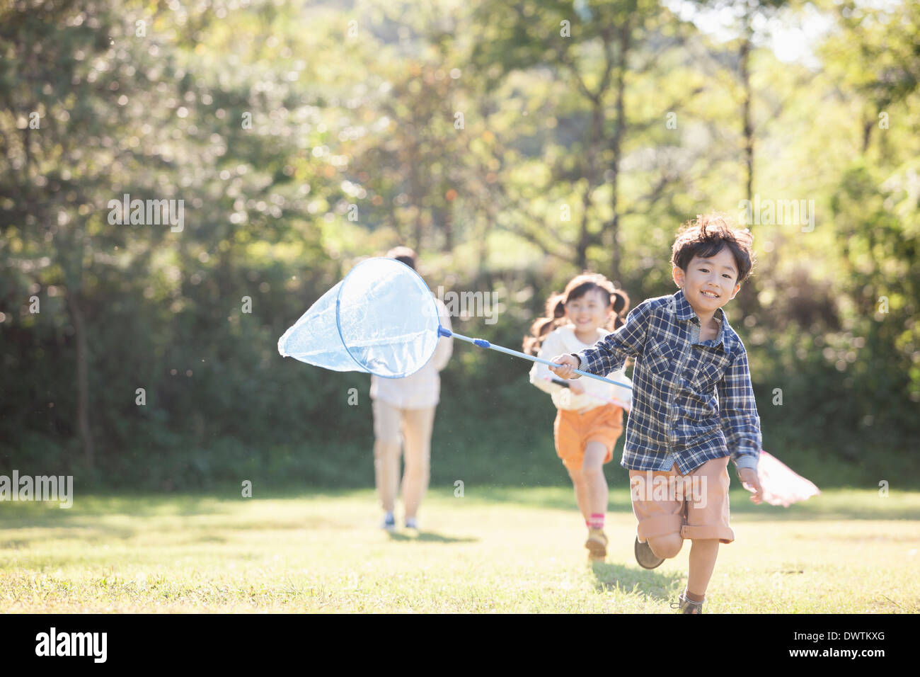 kids catching butterflies Stock Photo - Alamy