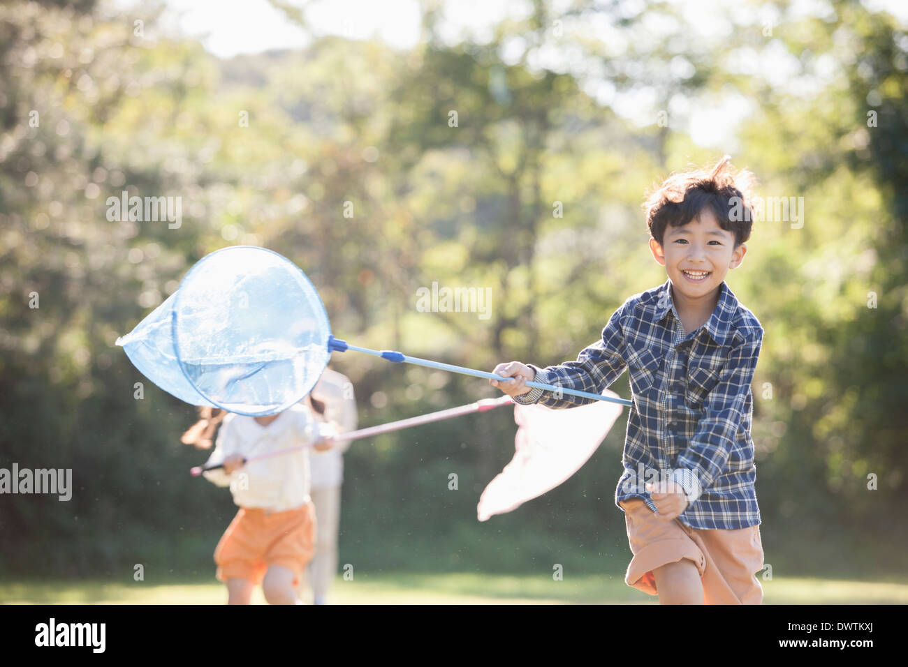 kids catching butterflies Stock Photo - Alamy