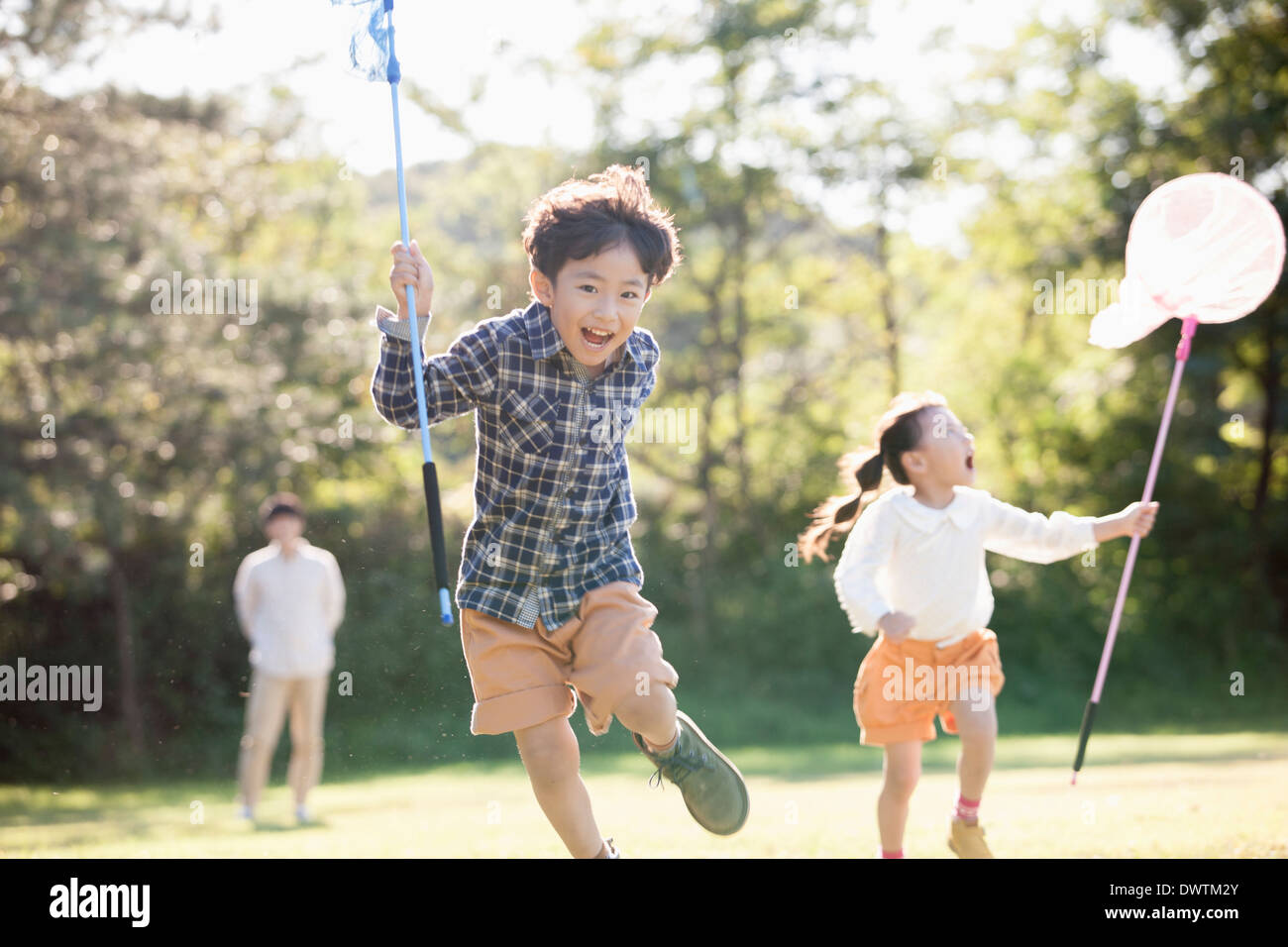 kids catching butterflies Stock Photo - Alamy