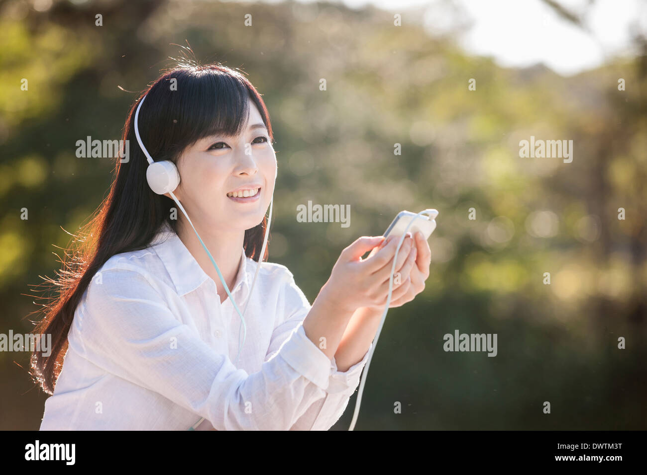 Carefree asian man listening music hi-res stock photography and images ...