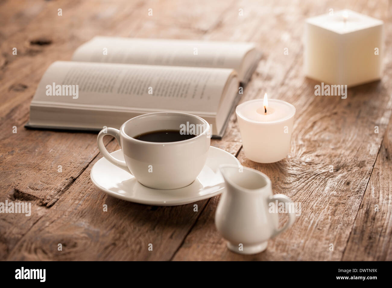 Candle flame next open book hi-res stock photography and images - Alamy