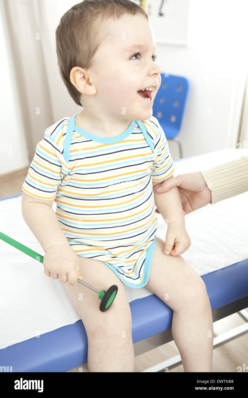 Reflex hammer child Stock Photo - Alamy