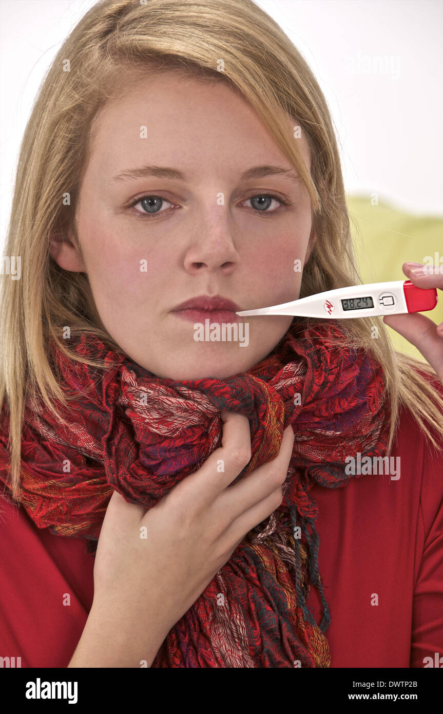 Woman holding throat thermometer hi-res stock photography and images ...