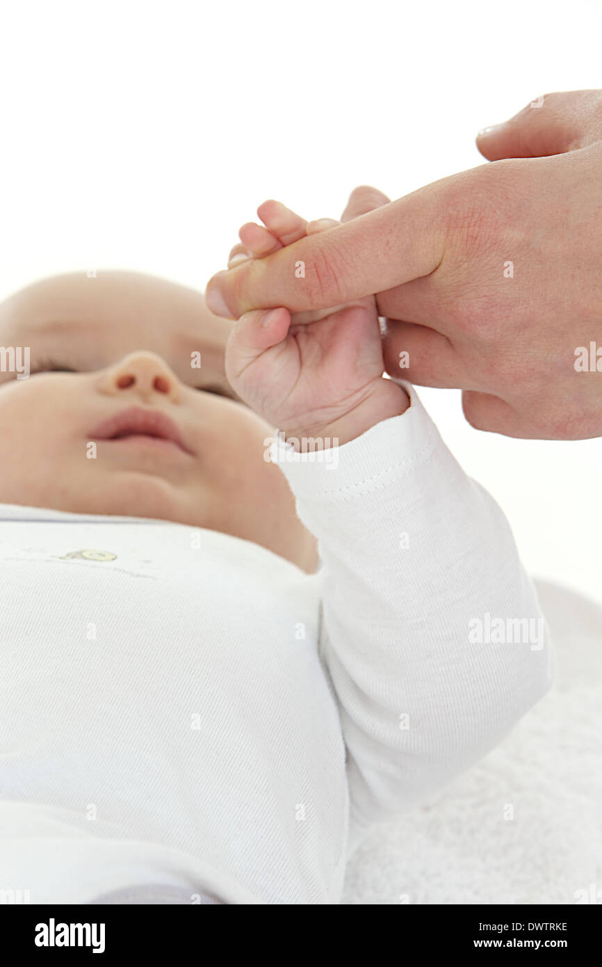 Baby boy holding out hand people hi-res stock photography and images ...