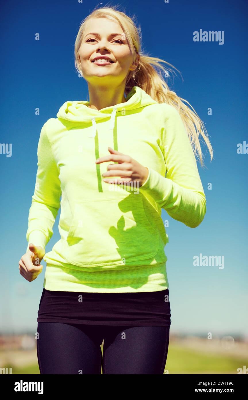 woman jogging outdoors Stock Photo - Alamy