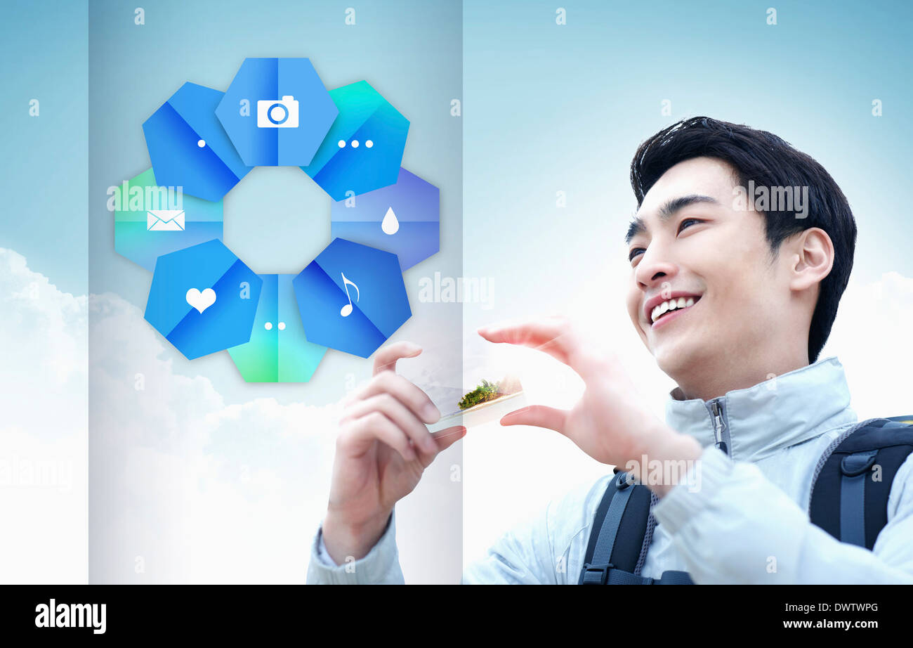 a man looking at some icons Stock Photo - Alamy