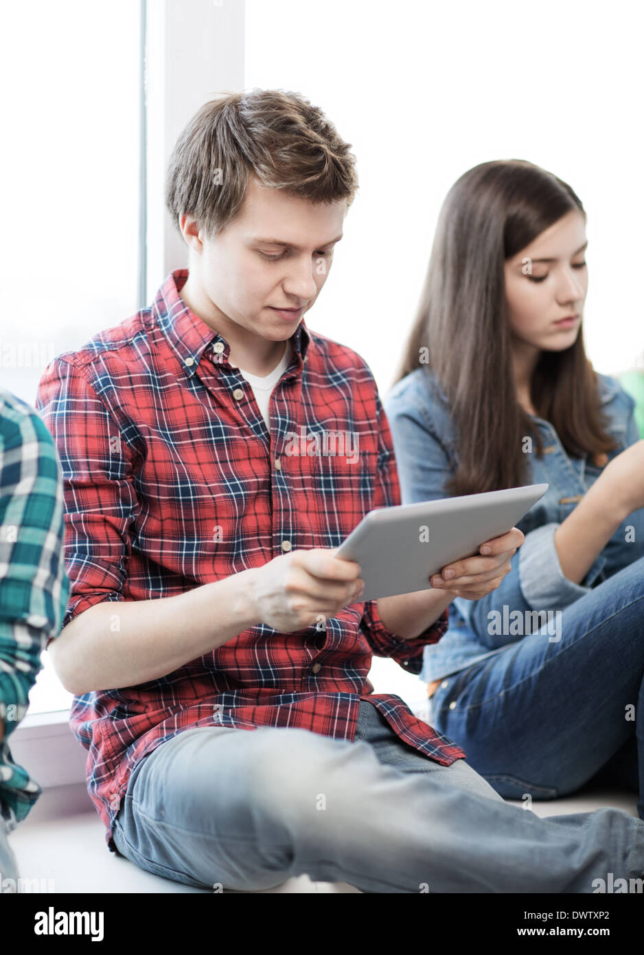 student looking into tablet pc at school Stock Photo - Alamy