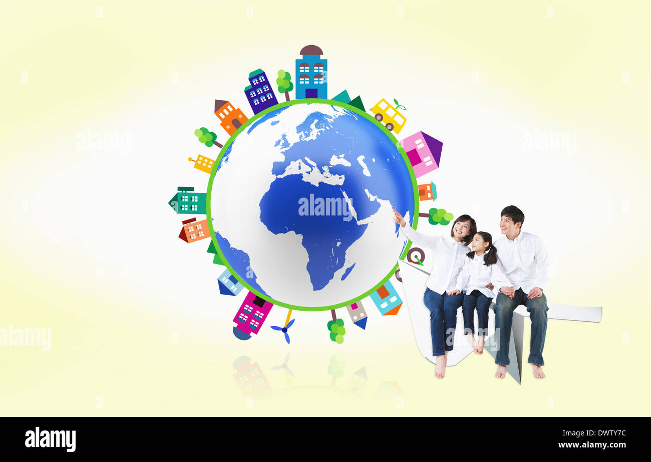 a family next to a globe with buildings Stock Photo - Alamy