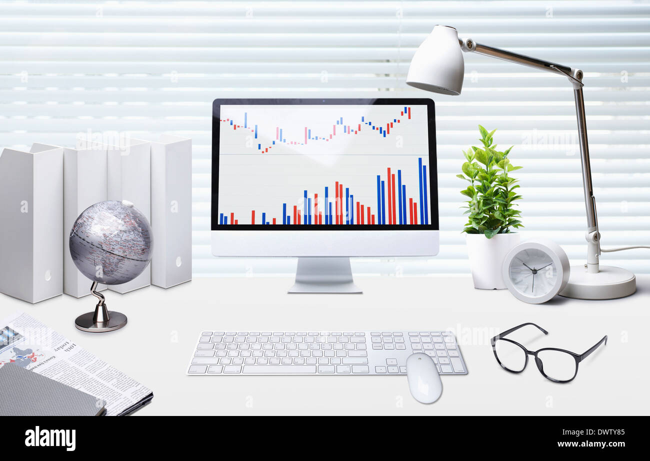 a computer screen on a working desk Stock Photo - Alamy