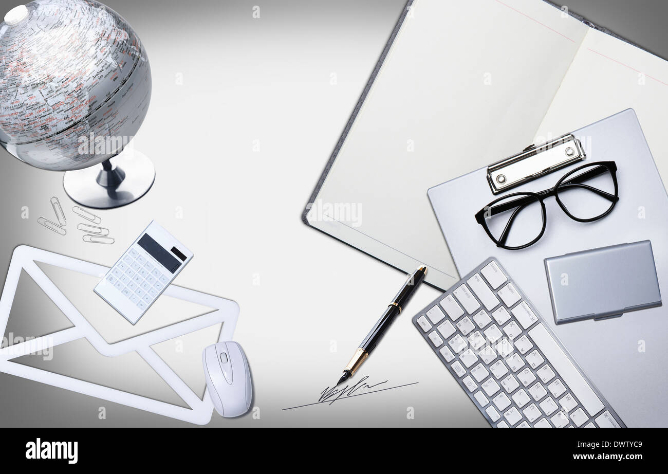 a desk full of work related items Stock Photo - Alamy