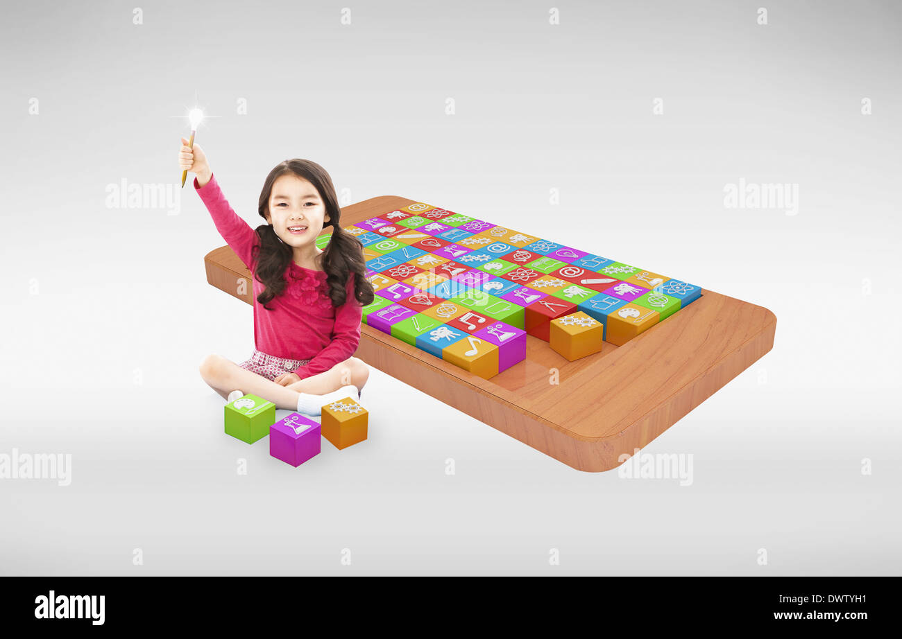 a girl playing with colorful cubes Stock Photo - Alamy