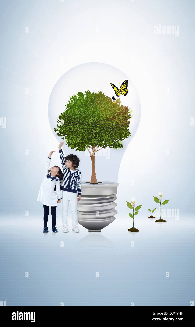 kids standing next to a light bulb Stock Photo - Alamy