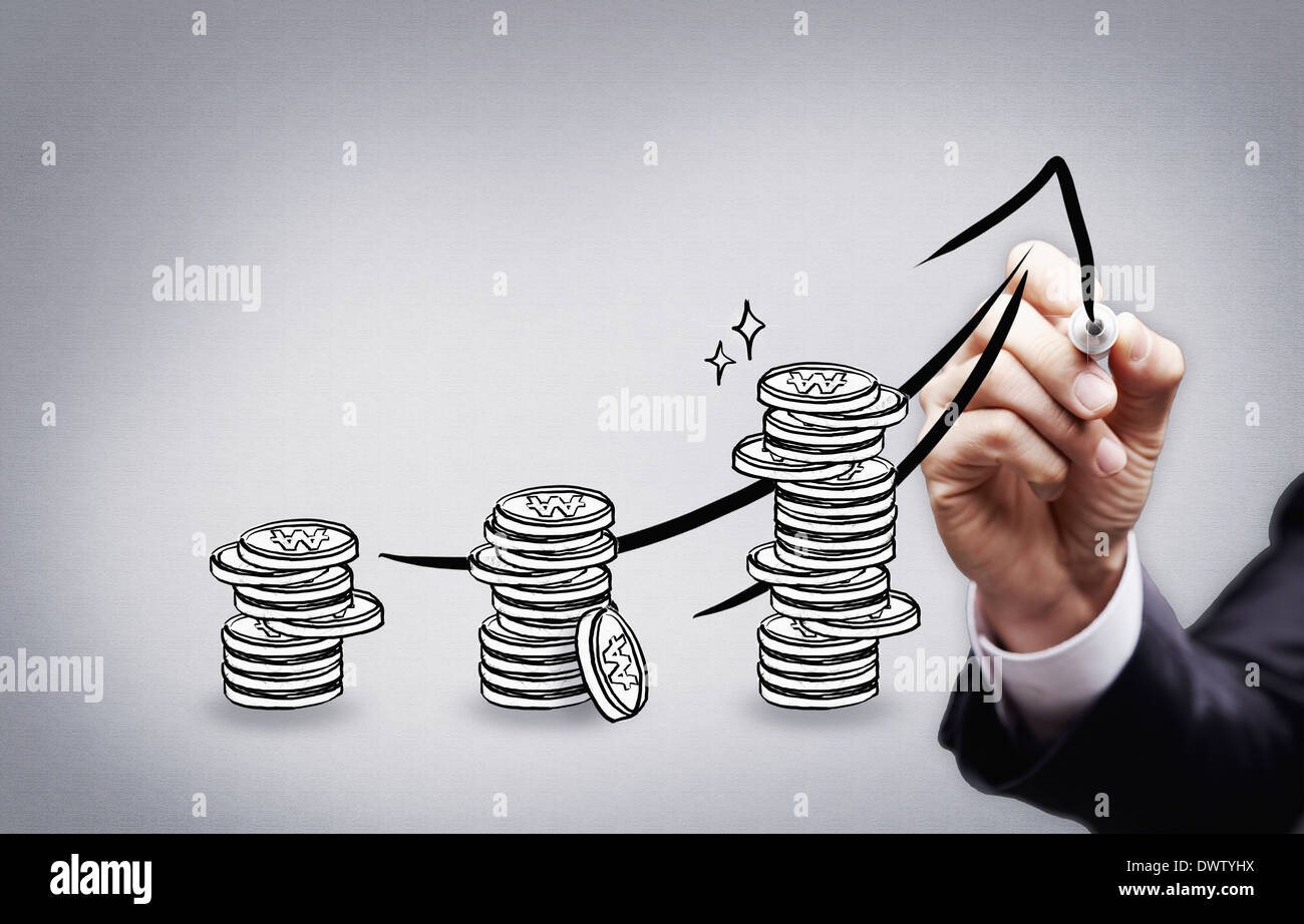 a business man drawing coins Stock Photo - Alamy