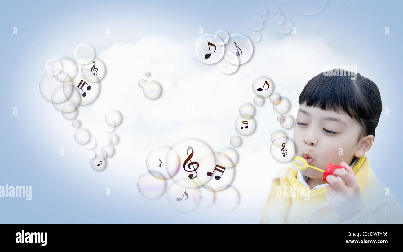 a girl blowing bubbles with music notes Stock Photo - Alamy