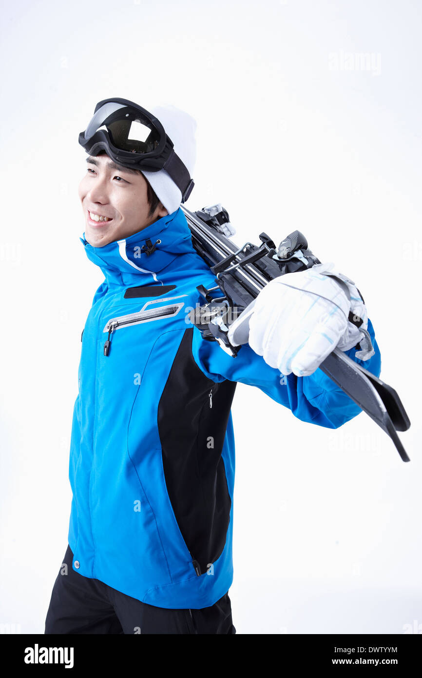 Man holding pair skis hi-res stock photography and images - Alamy