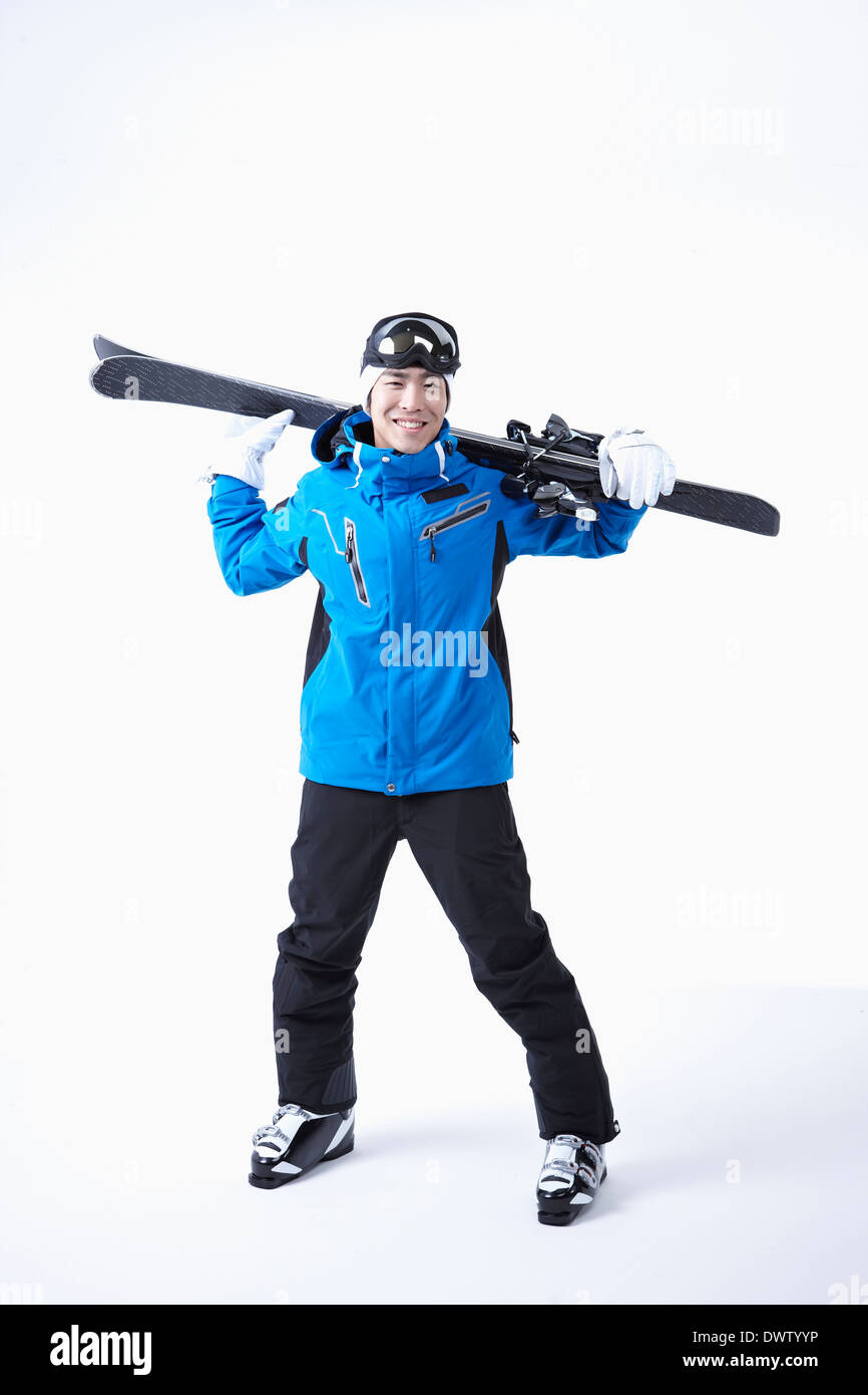 Man holding pair skis hi-res stock photography and images - Alamy