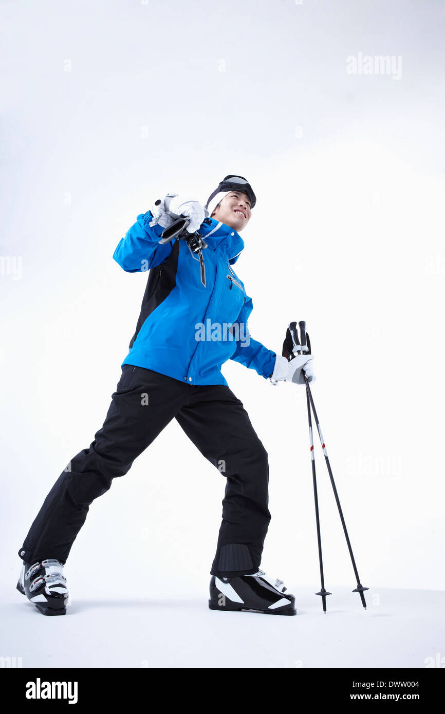 Man holding pair skis hi-res stock photography and images - Alamy