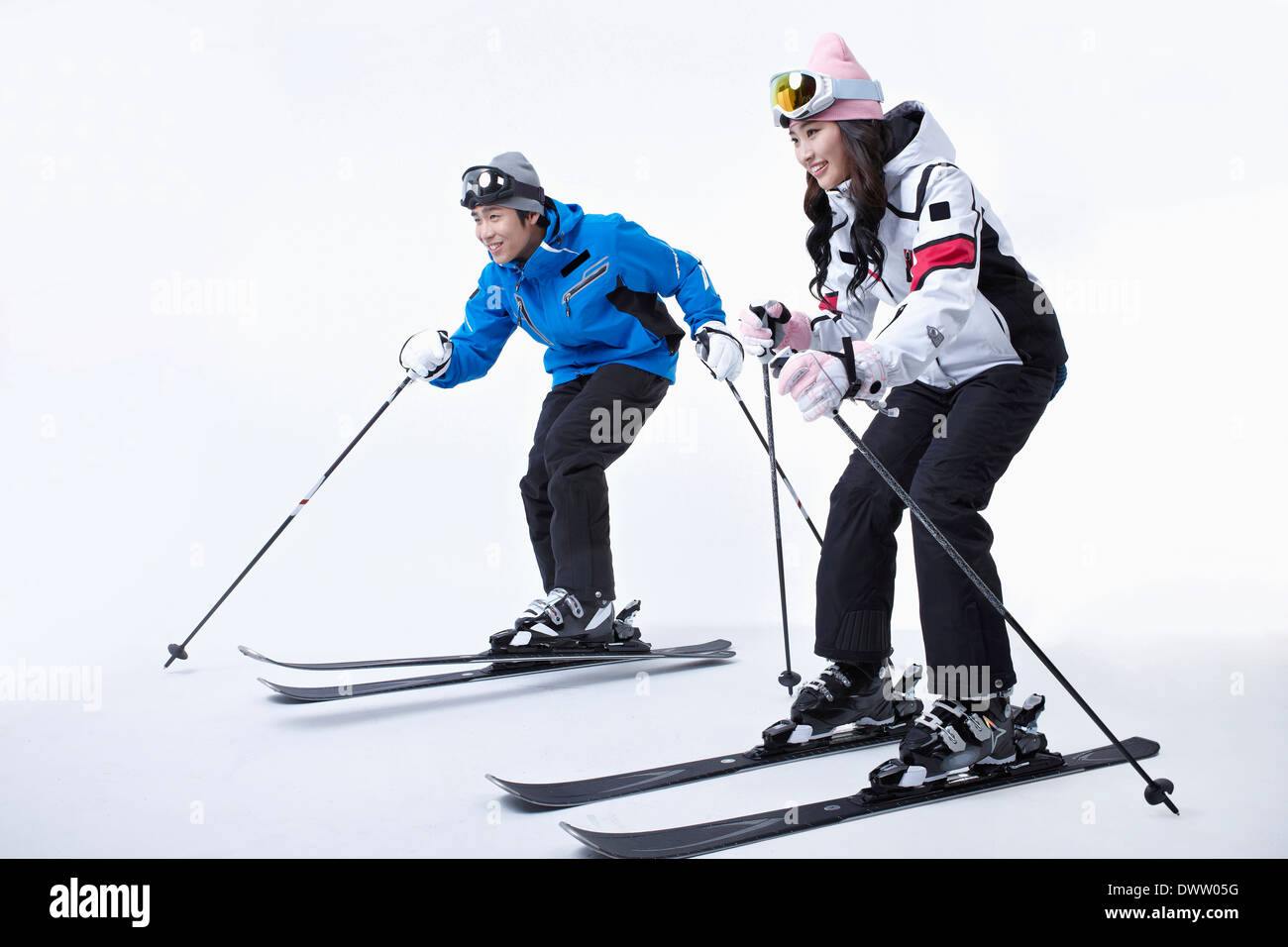 a couple wearing a pair of skis Stock Photo - Alamy