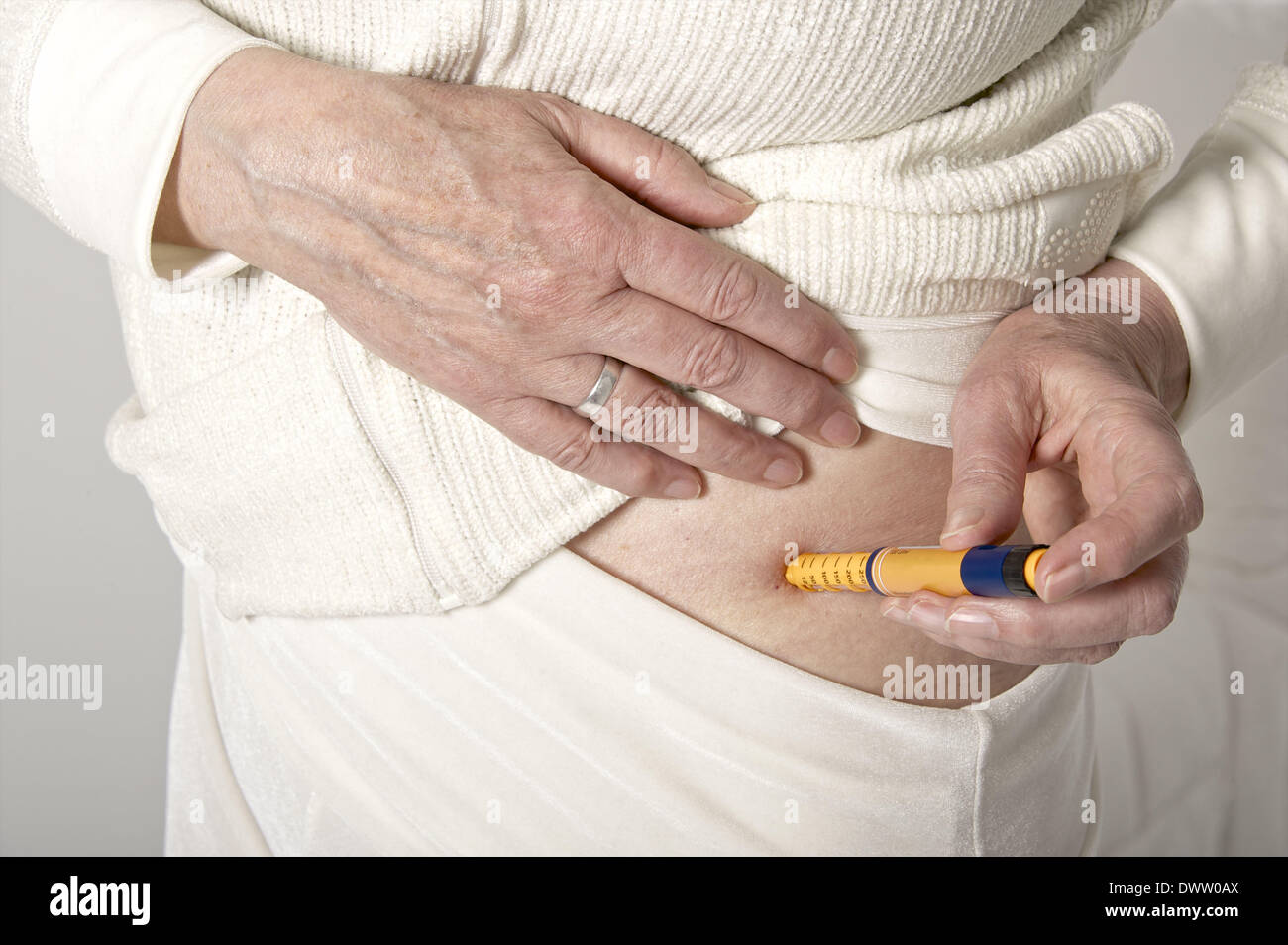 Injection insulin senior Stock Photo - Alamy