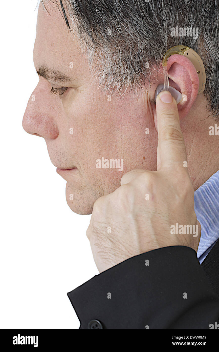 Hearing aid senior Stock Photo - Alamy