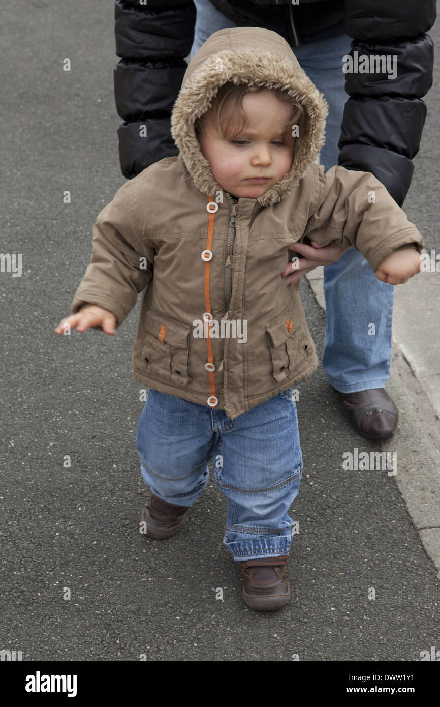 Walking learning child Stock Photo - Alamy