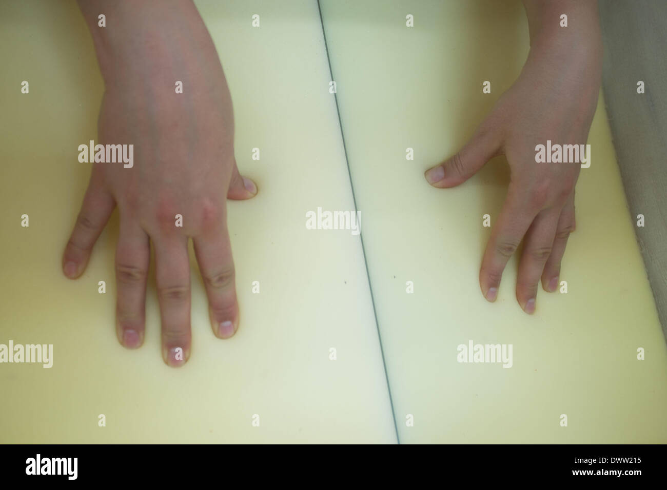 Mirror box ergotherapy Stock Photo - Alamy