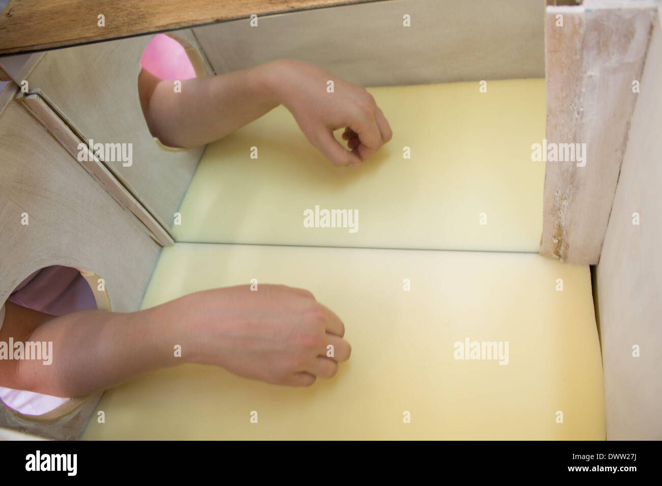 Mirror box ergotherapy Stock Photo - Alamy