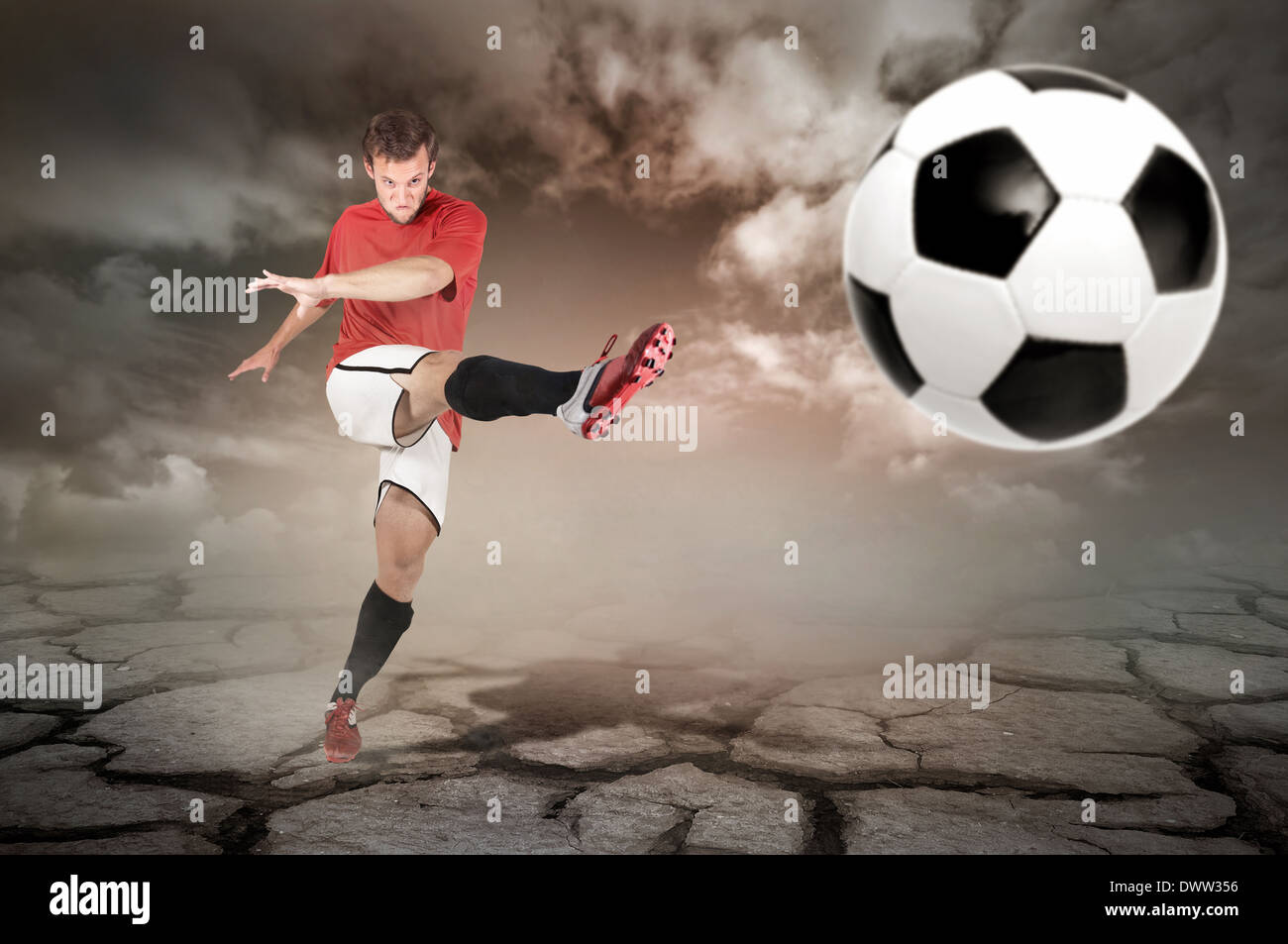 Football soccer player kicking ball hi-res stock photography and images ...