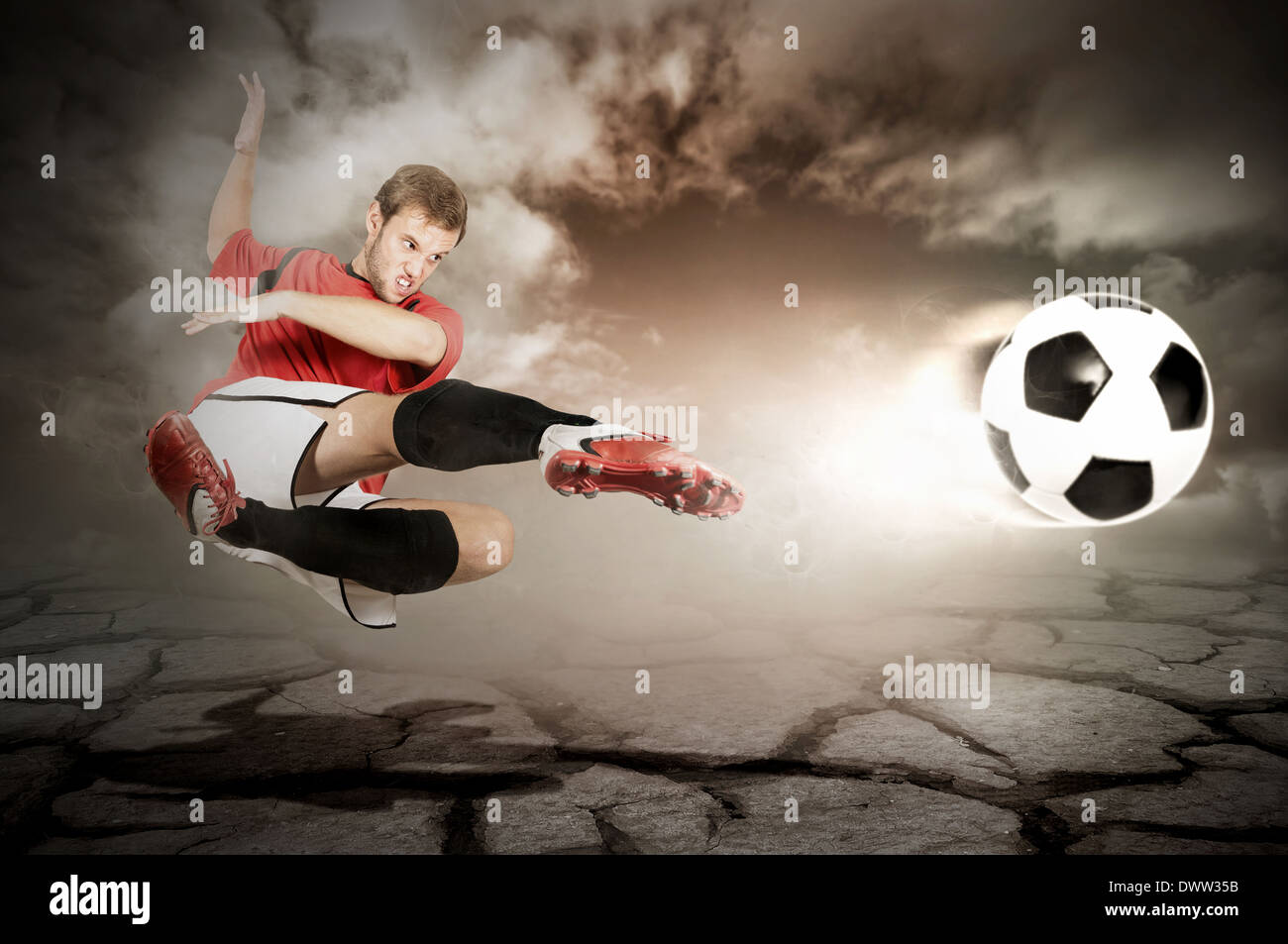 Football player kicking ball hi-res stock photography and images - Alamy