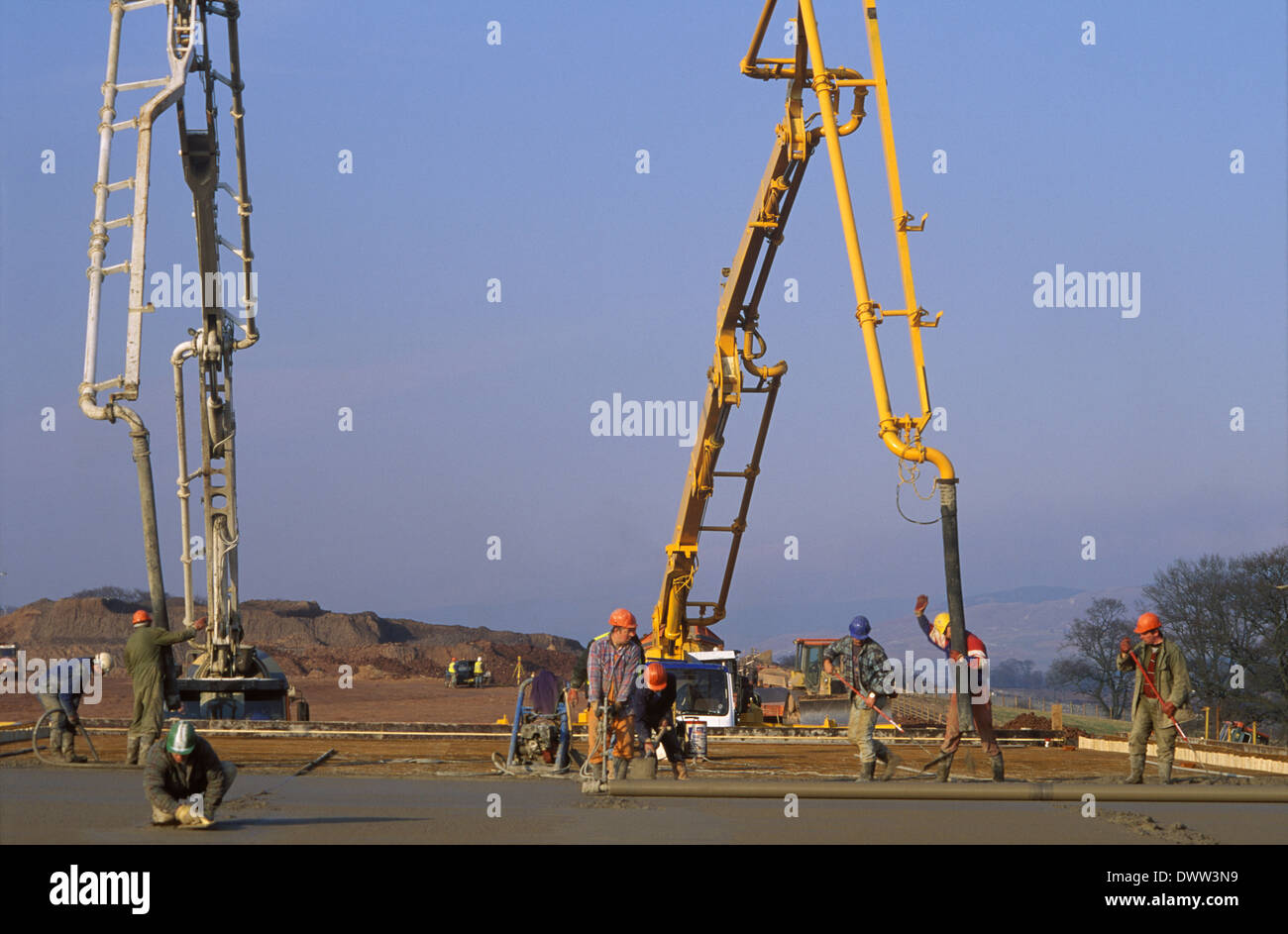 Motorway Construction, Pouring and levelling concrete Stock Photo - Alamy