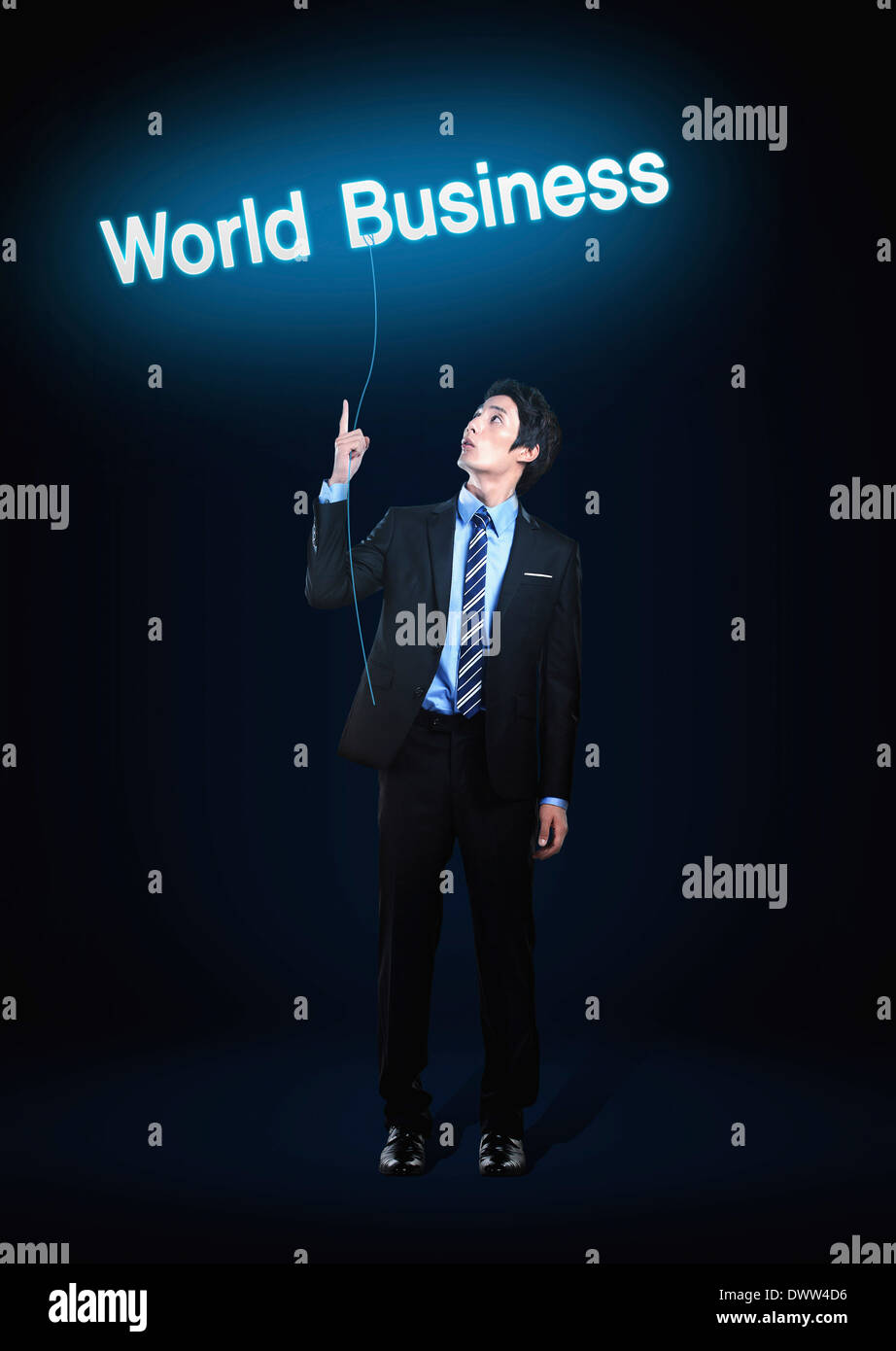 a business man with the word world business Stock Photo - Alamy