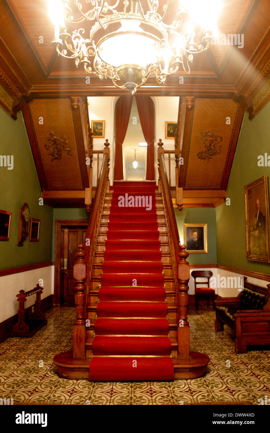 The imposing staircase in the entrance hall of the Lord Milner Hotel in ...